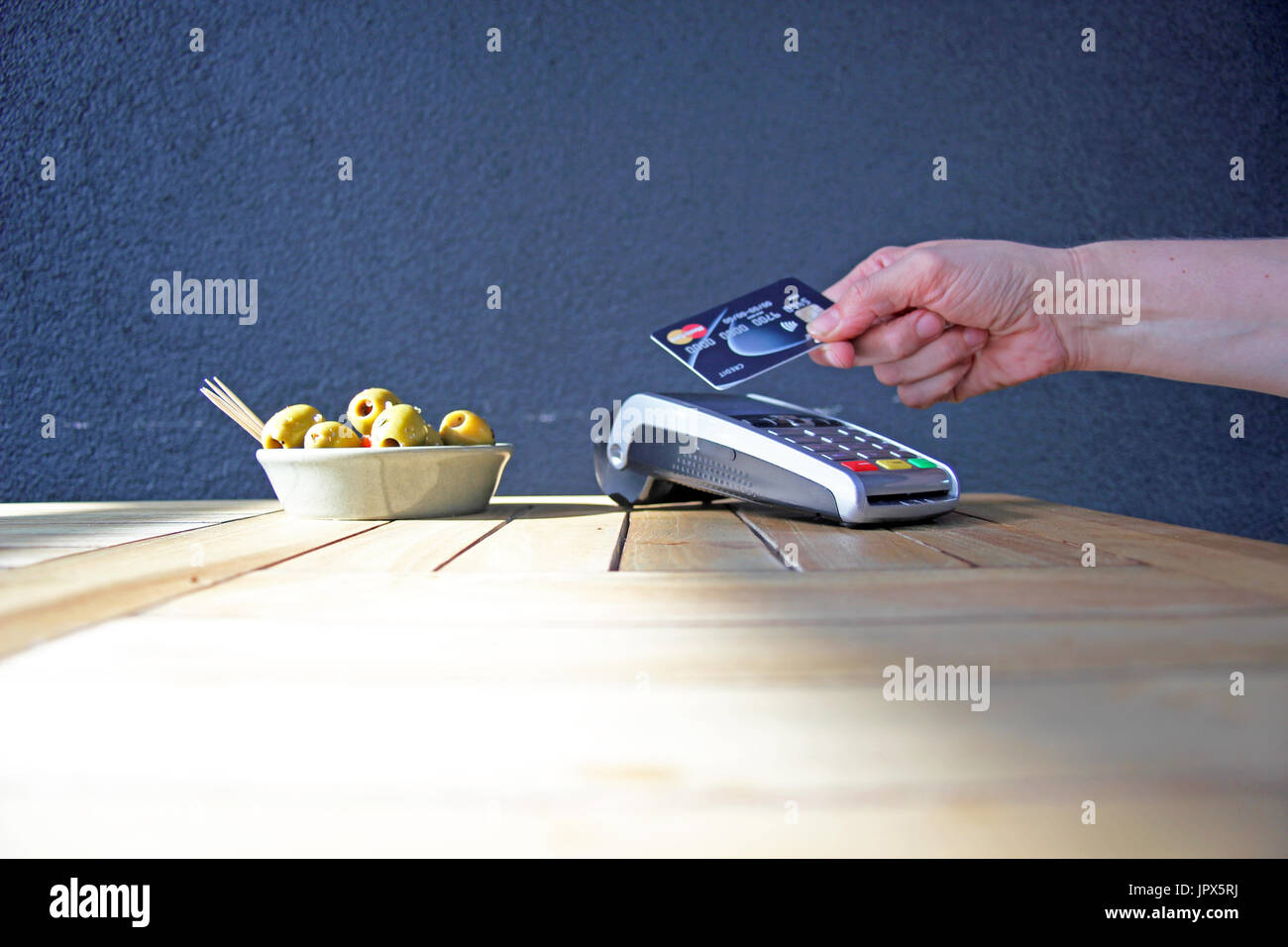 contactless payment card pdq background copy space with hand holding ...