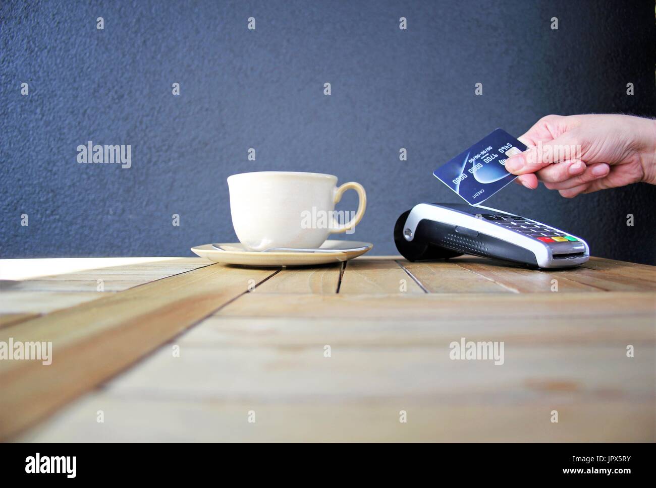 contactless payment card pdq background copy space with hand holding ...