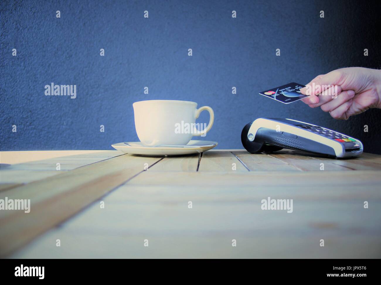 contactless payment card pdq background copy space with hand holding ...