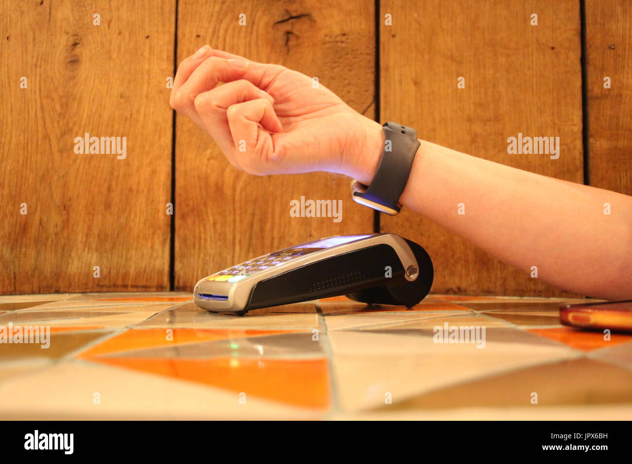 contactless payment watch apple pdq with hand holding credit card ready ...