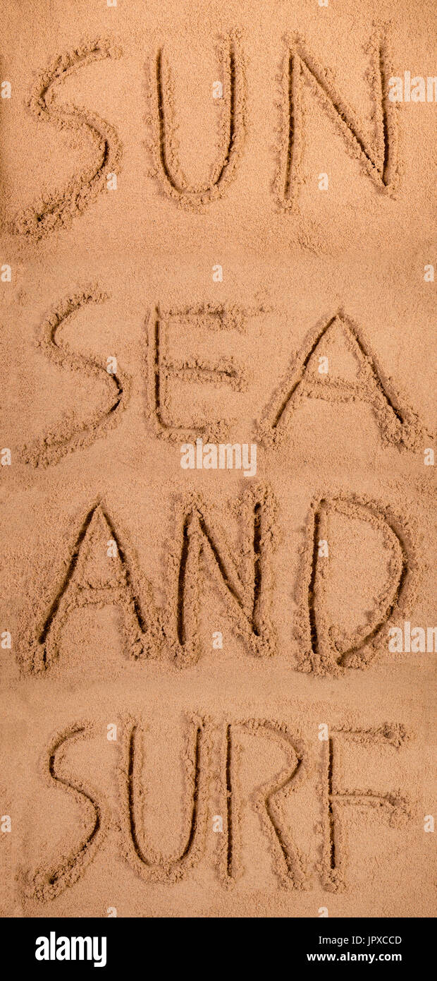 Sun sea and surf written in soft wet sand on a beach Stock Photo - Alamy