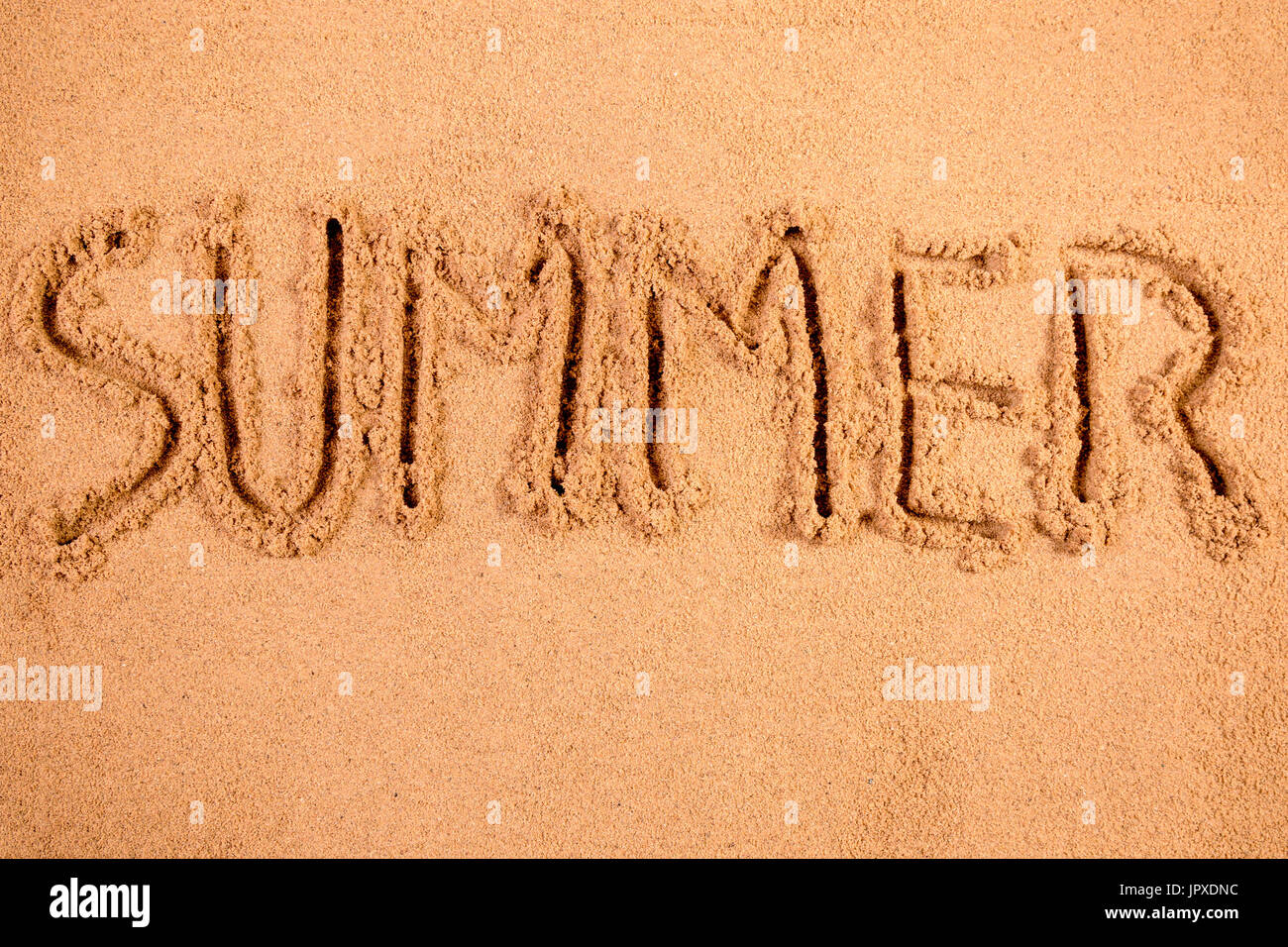 Summer written in soft wet sand on a beach Stock Photo - Alamy