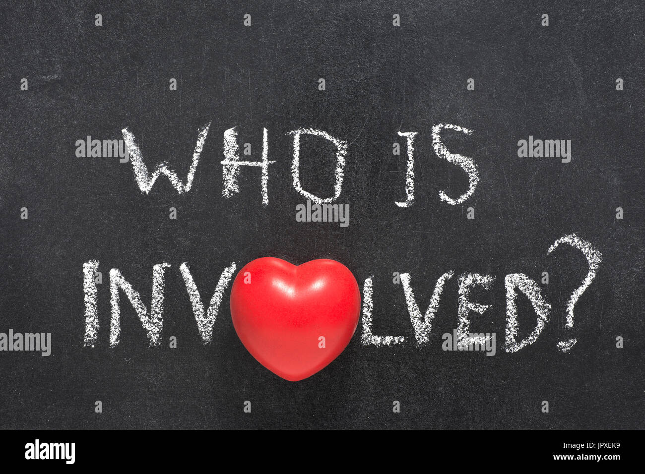 who is involved question handwritten on blackboard with heart symbol ...