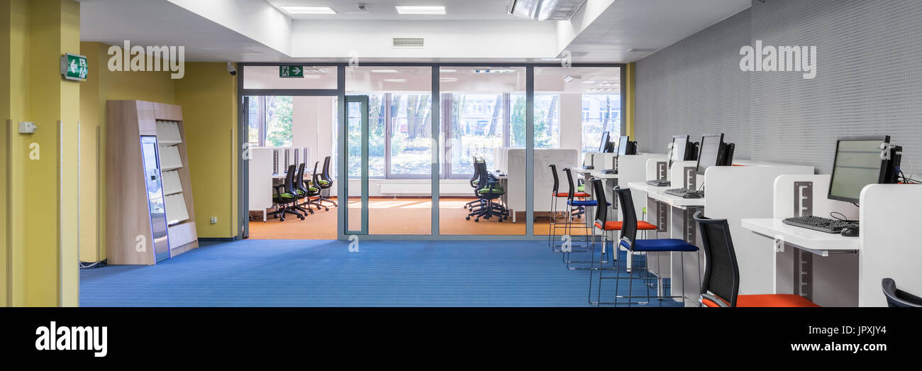 Panorama of light and spacious university interior with computer area ...