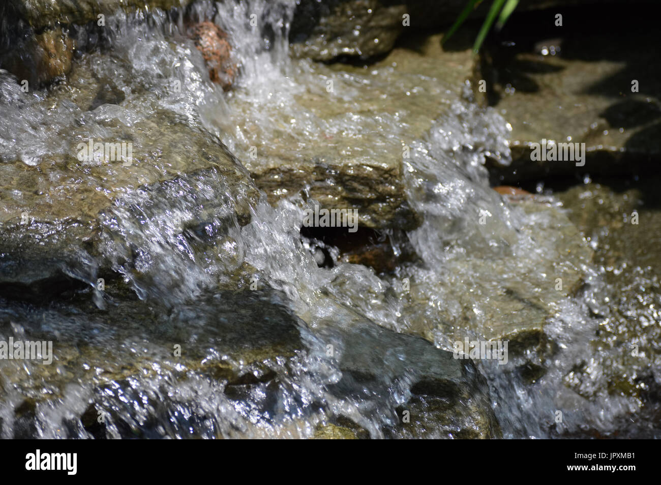 Small waterfall over the rocks Stock Photo - Alamy