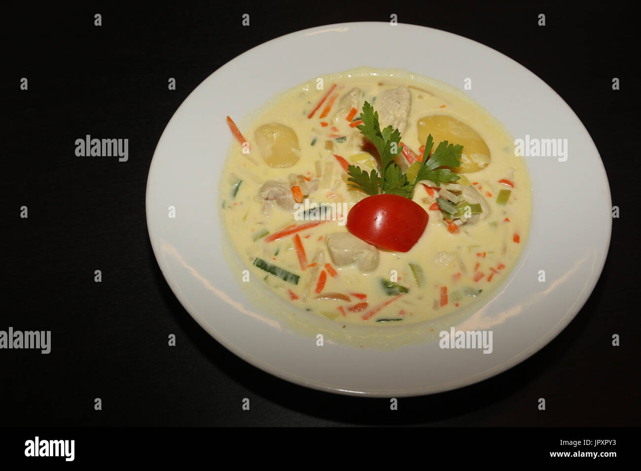 Chicken waterzooi or chicken stew from Ghent Flanders, Belgium. A ...