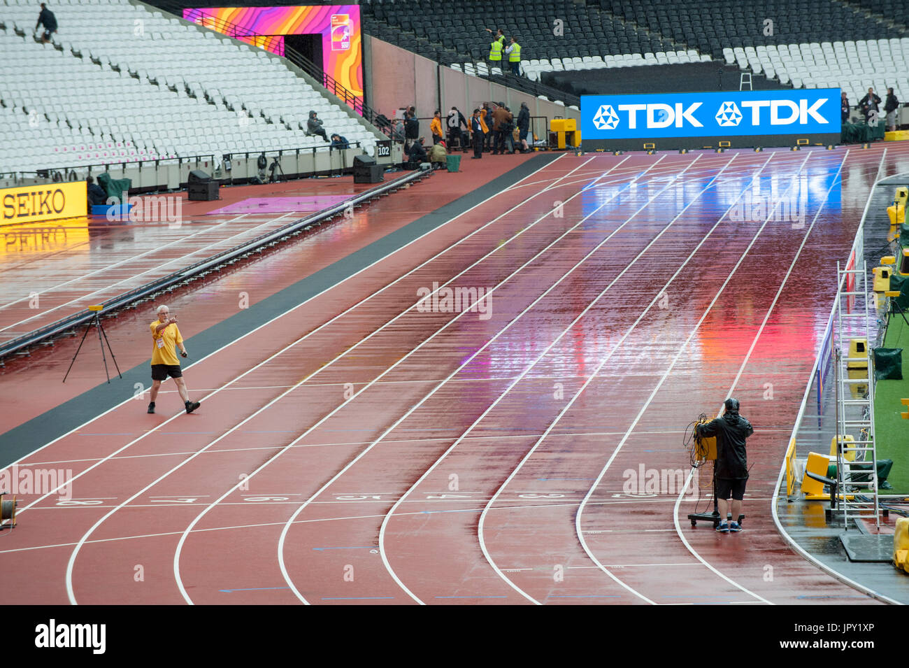 London, UK. 2nd Aug, 2017. Technicians at work on a rain soaked track ...