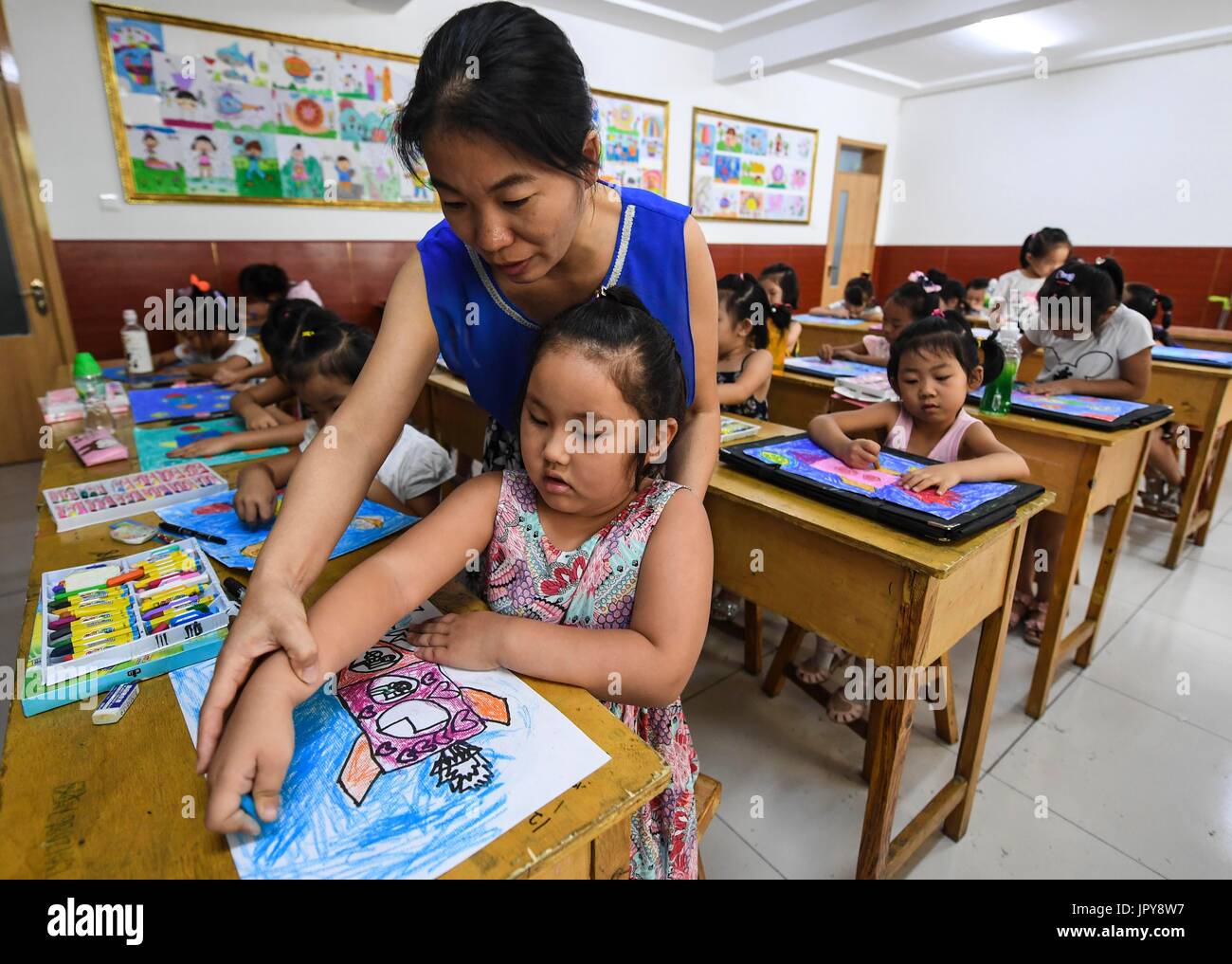 Dachang, China's Hebei Province. 3rd Aug, 2017. Children learn painting ...