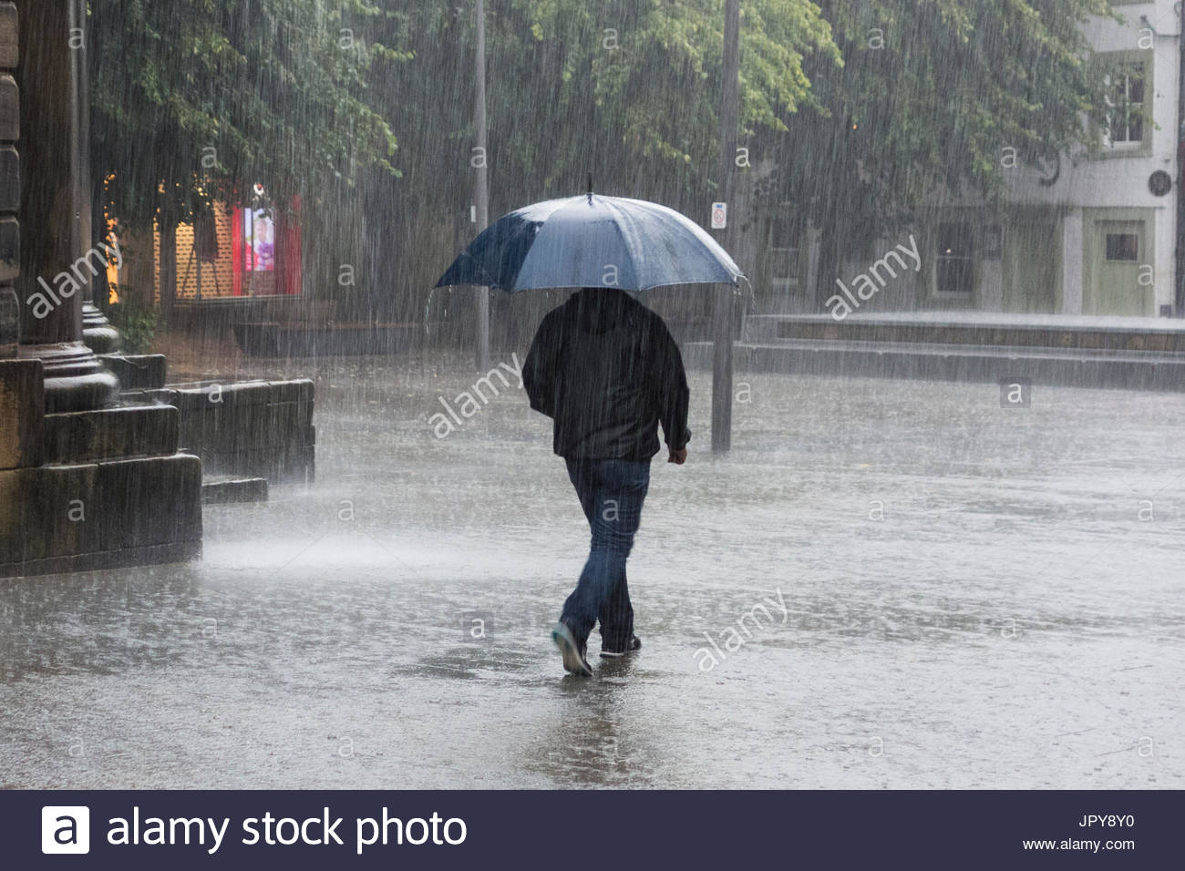Umbrella Rain Heavy High Resolution Stock Photography and Images - Alamy