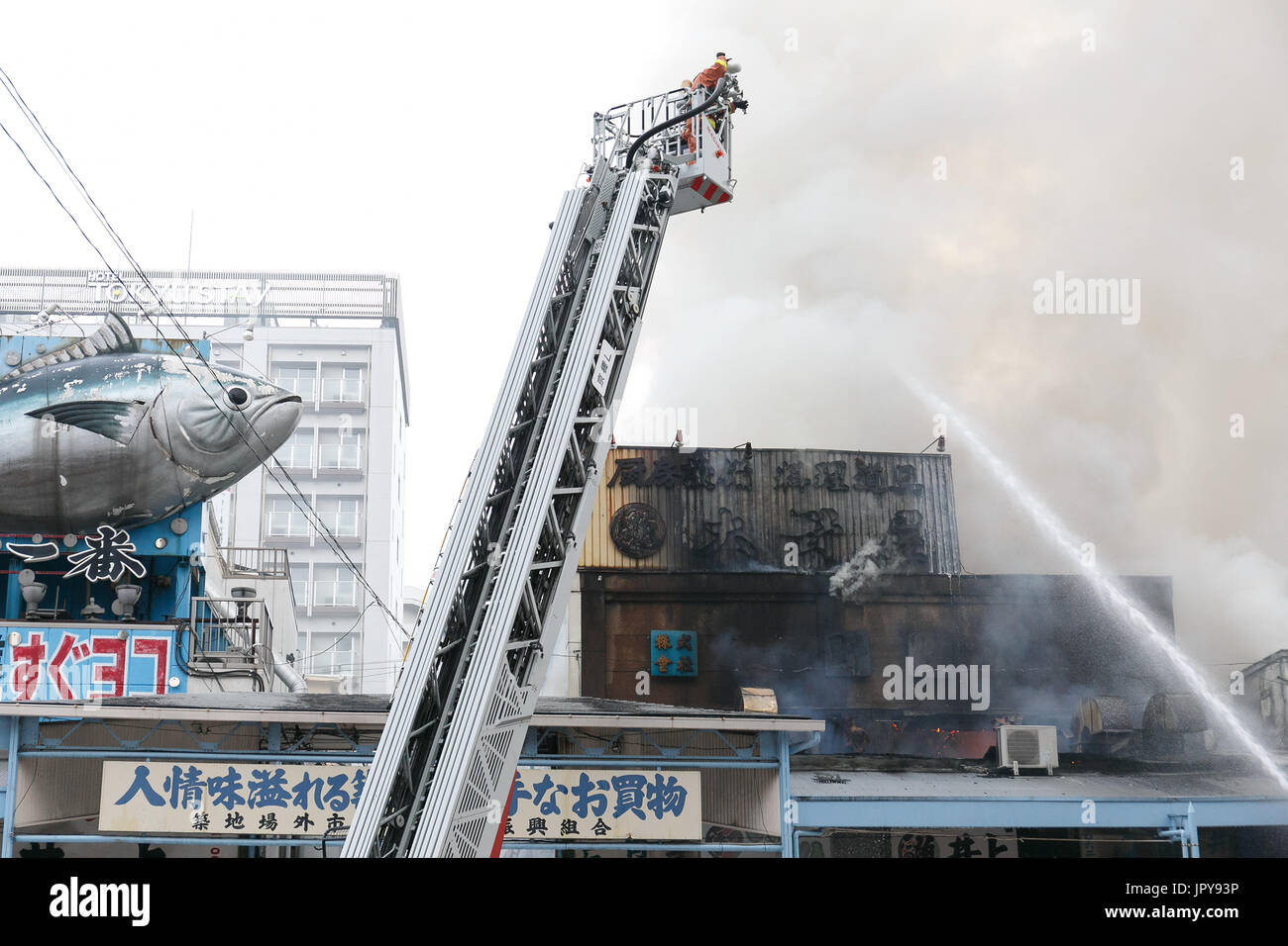 Tokyo, Japan. 3rd July, 2017. Fire fighters try to bring a fire under ...