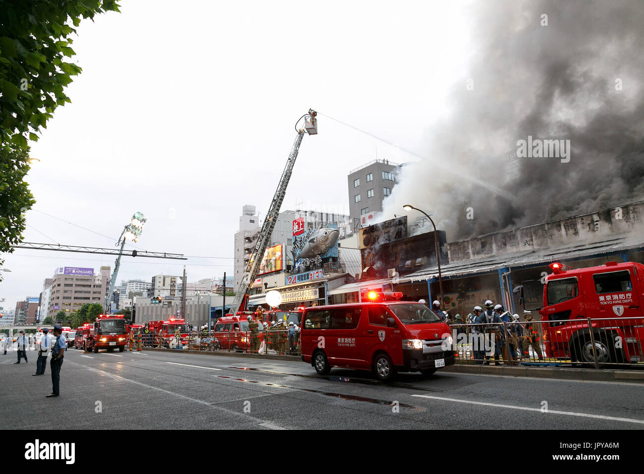 Tokyo, Japan. 3rd July, 2017. Firefighters try to bring a fire under ...