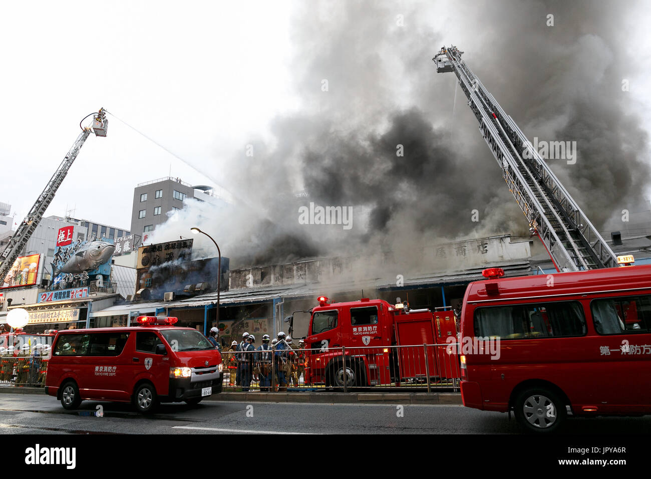 Tokyo, Japan. 3rd July, 2017. Firefighters try to bring a fire under ...