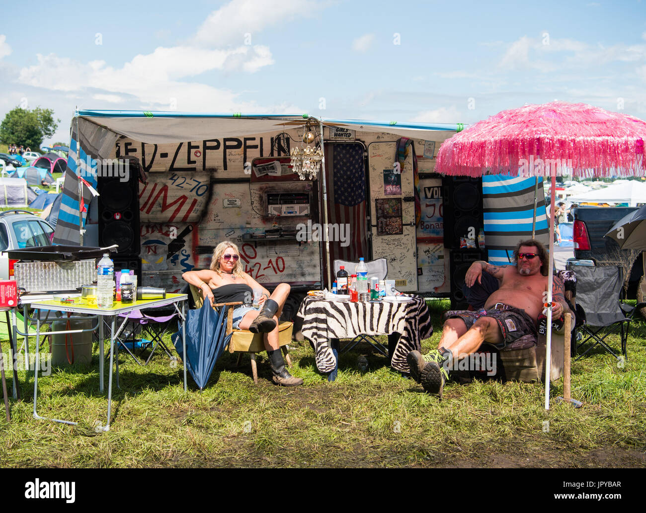 Wacken, Germany. 2nd Aug, 2017. Chris (L) and Horse (R) are sitting in ...