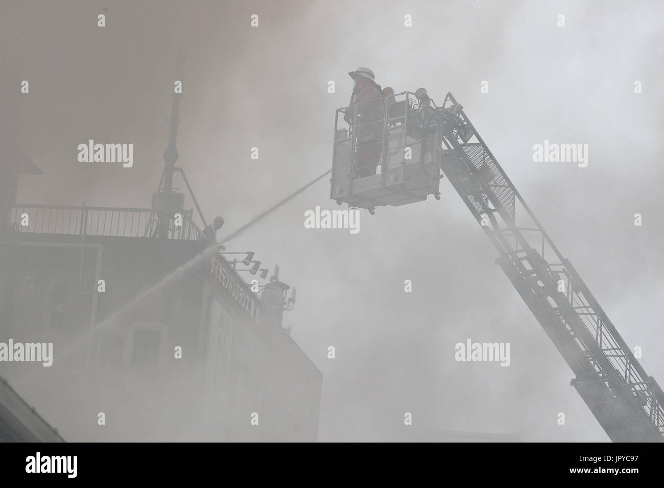 Tokyo, Japan. 3rd Aug, 2017. A firefighter tries to bring a fire under ...