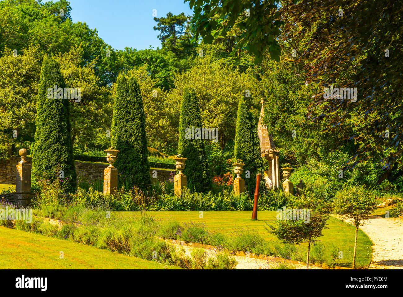 Beautiful park in antique style, stone decorations on pedestals ...