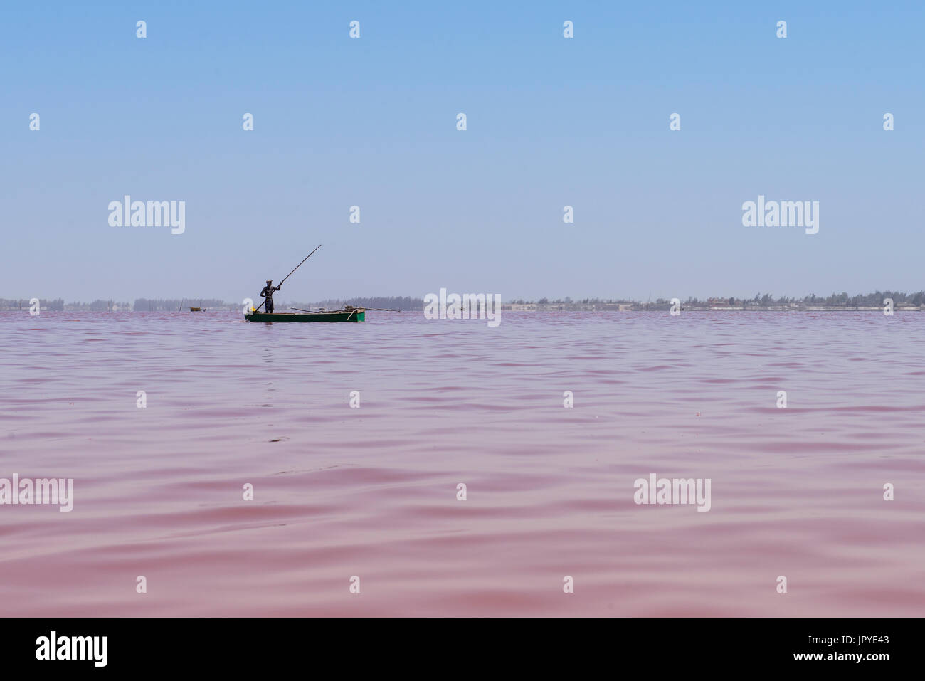 Salt collector in his canoe - Pink Lake Senegal Stock Photo - Alamy