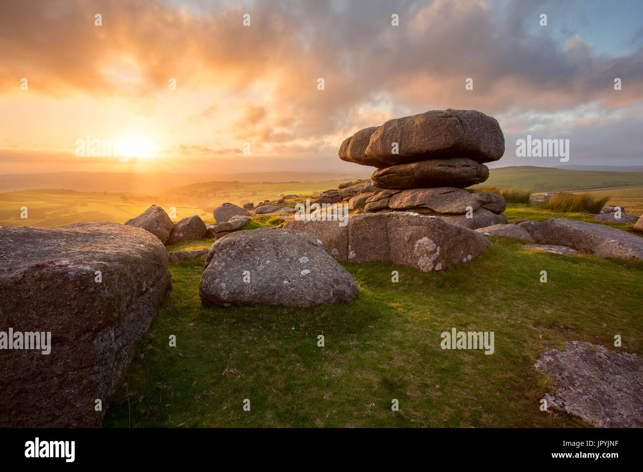 Sunset on Roo's Tor Dartmoor National Park Devon uk Stock Photo - Alamy