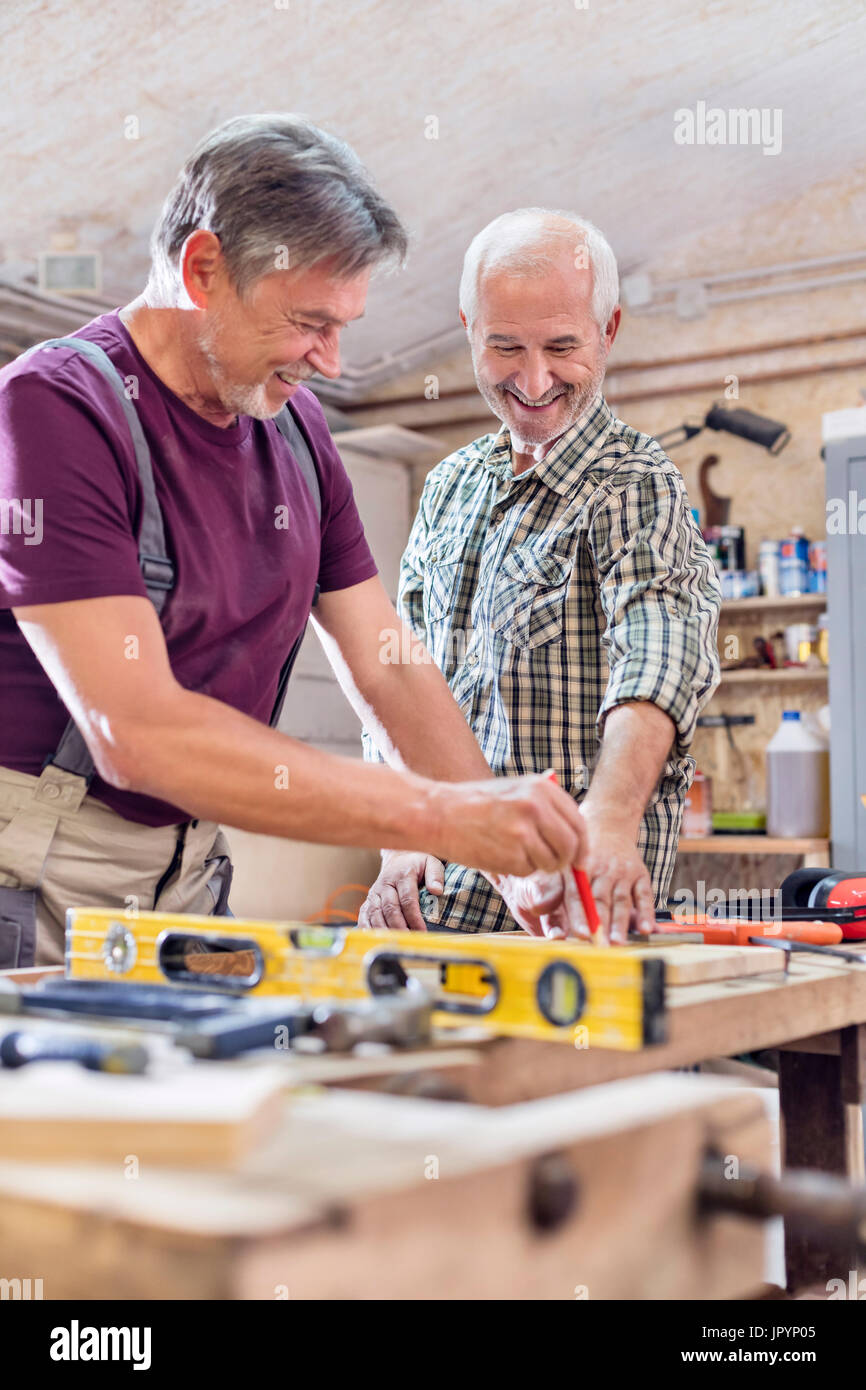 Two men standing workbench hi-res stock photography and images - Alamy