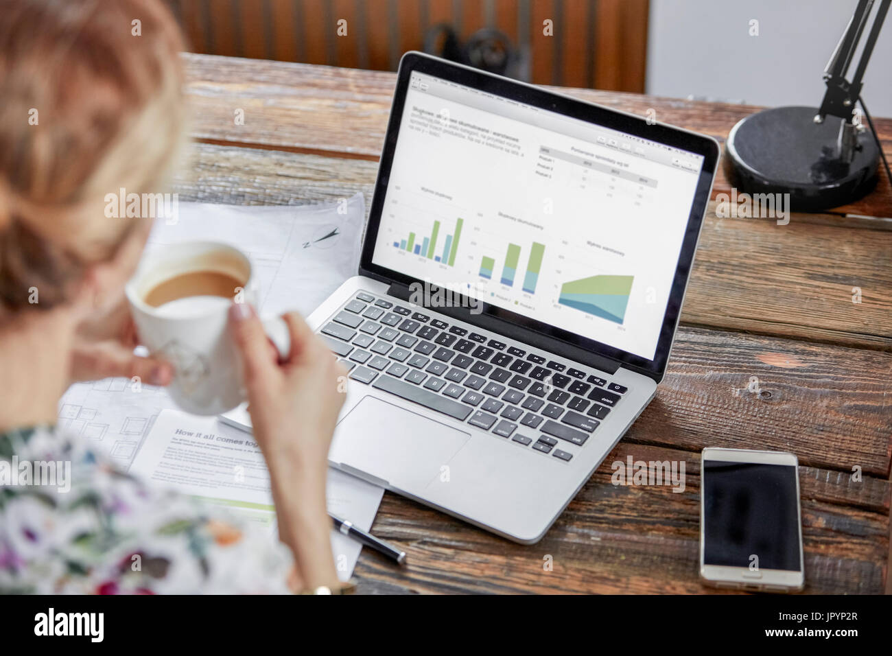Woman reviewing technology data desk hi-res stock photography and ...