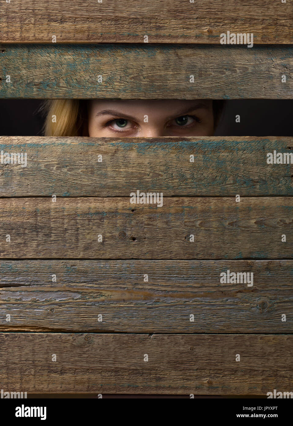 Person looking through hole in wall hi-res stock photography and images ...