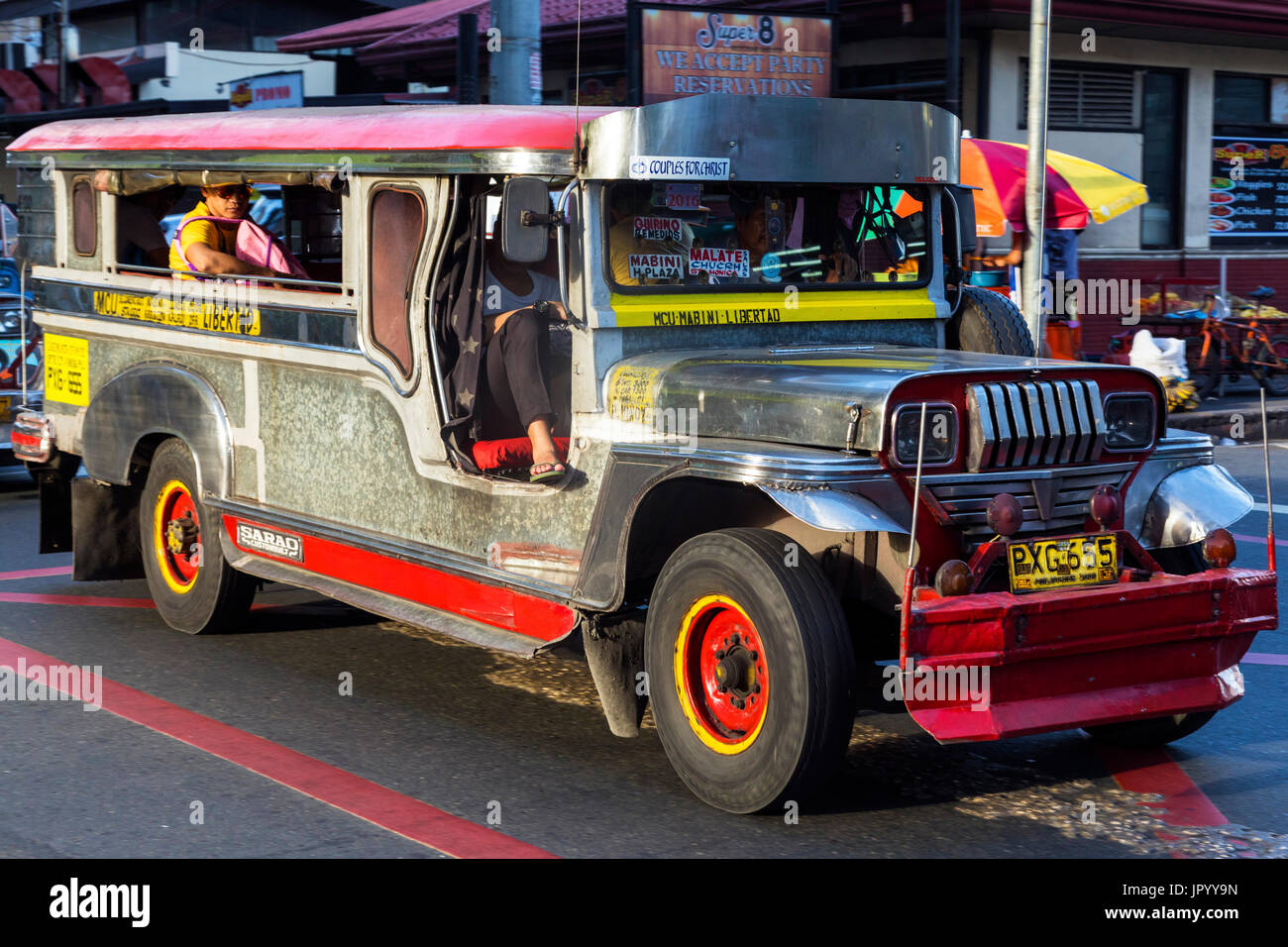 Jeepney and passengers, Manila, Philippines Stock Photo - Alamy