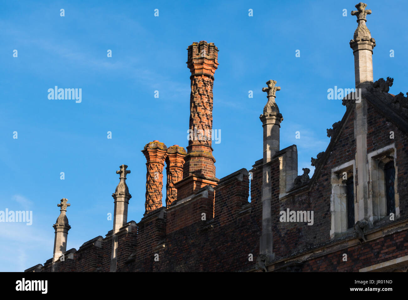 Detail of chimneys and parapet along the top of a Tudor building ...