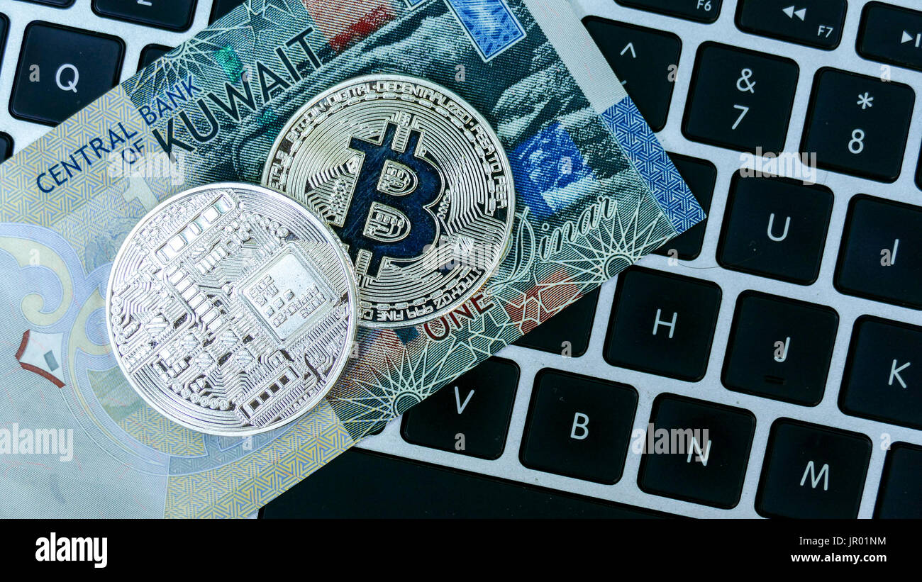 Bitcoin on Kuwait Dinar banknote. Electronic money exchange concept ...