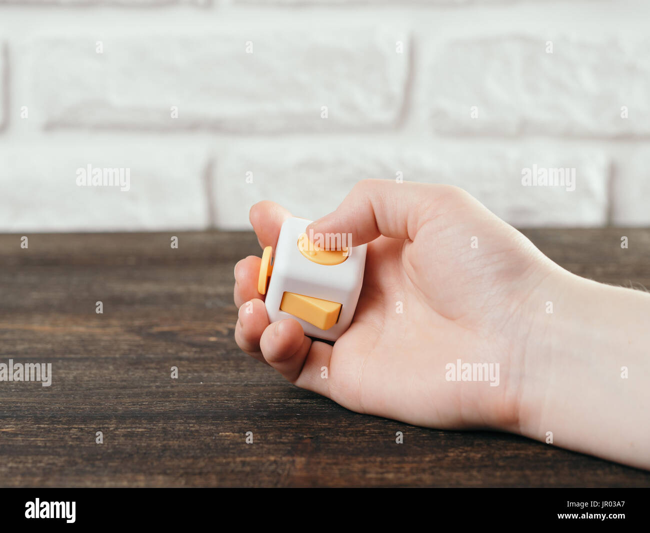 Fidget cube stress fingers toy Stock Photo - Alamy