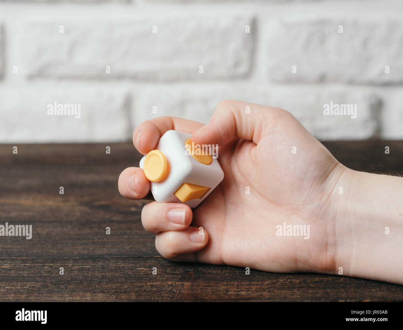 Fidget cube stress fingers toy Stock Photo - Alamy