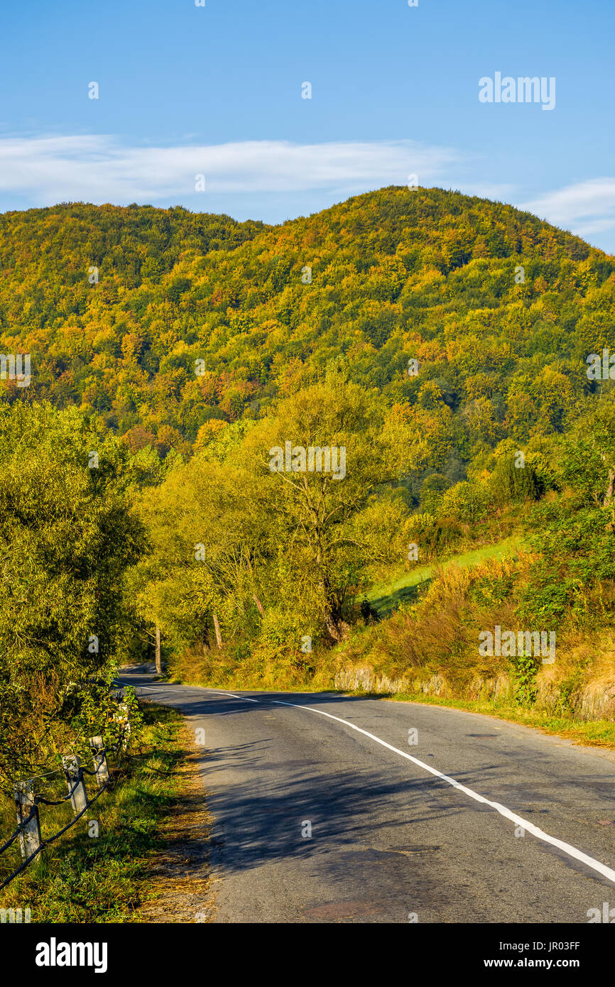 asphalt road in mountainous countryside. beautiful early autumn morning ...