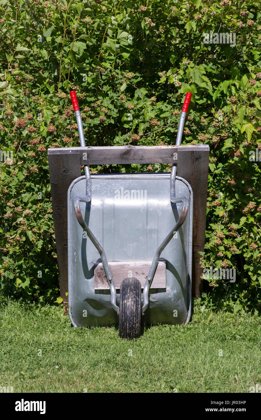 Parked wheelbarrow on Lawn Stock Photo - Alamy