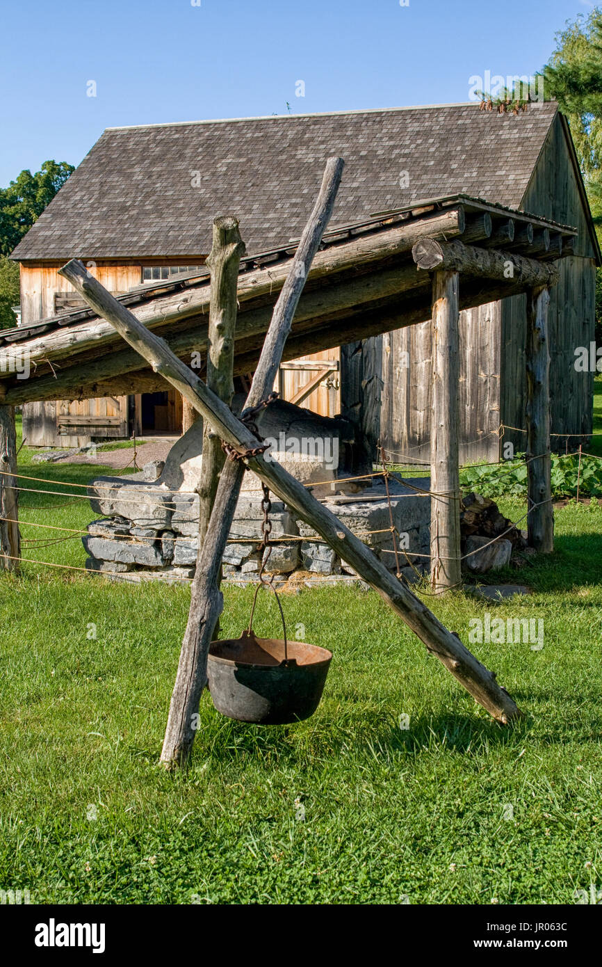 Wooden tripod with rusty pot for cooking Stock Photo - Alamy