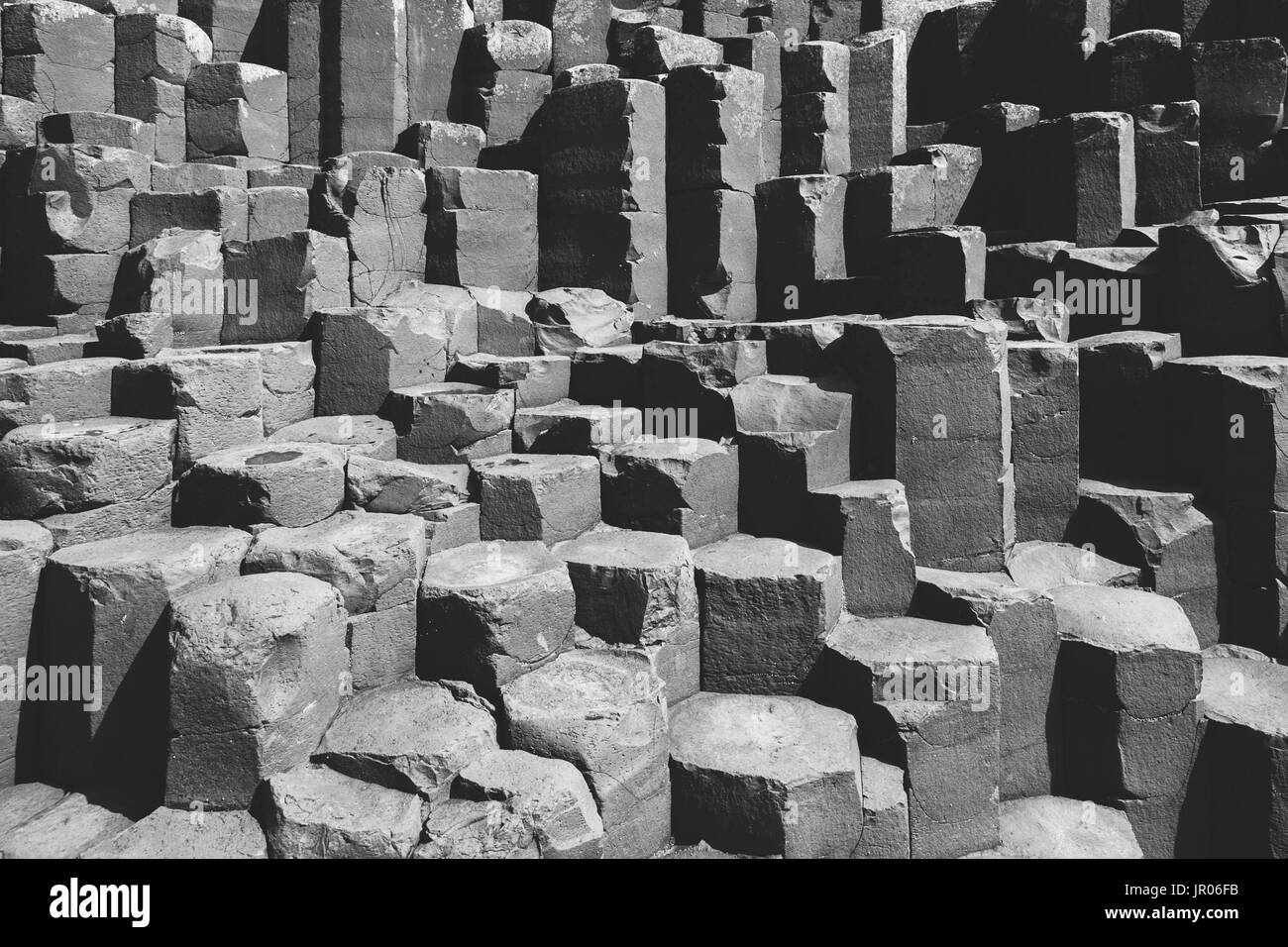 Bed of volcanic hexagonal rocks basalt columns at the Giant`s Causeway ...