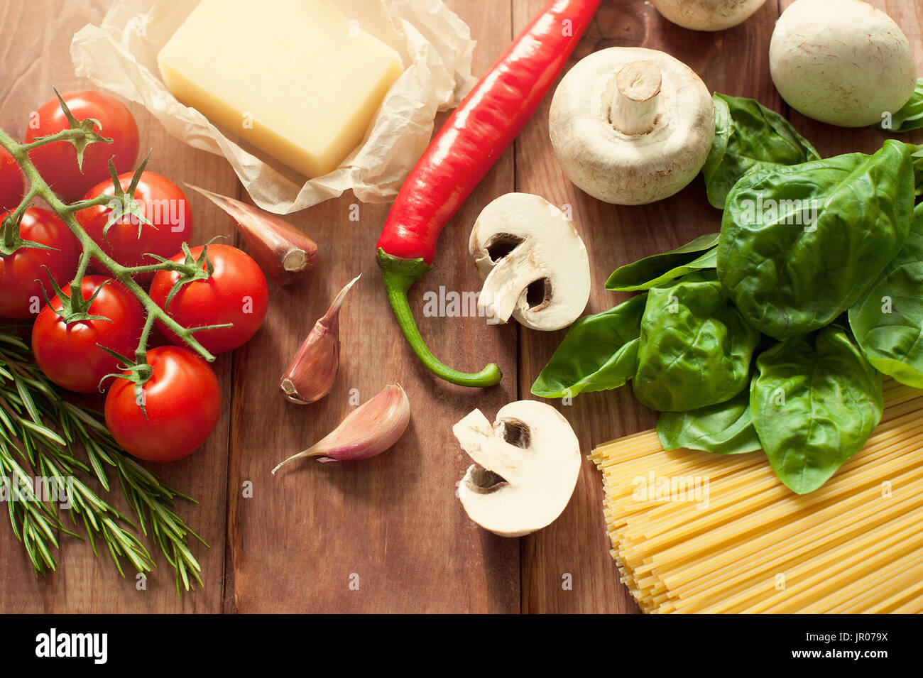 TABLE TOP FILLED WITH ASSORTED FRESH ITALIAN INGREDIENTS: BASIL,HERBS ...