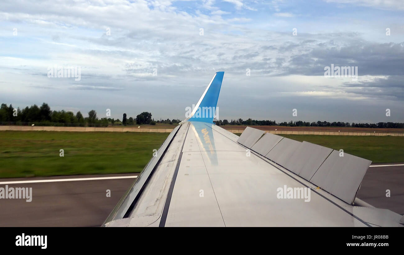 Plane is landing on runway in airport Stock Photo - Alamy