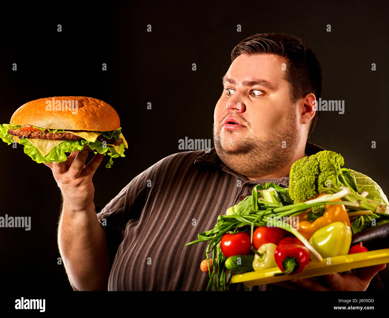 Diet fat man who makes choice between healthy and unhealthy food ...