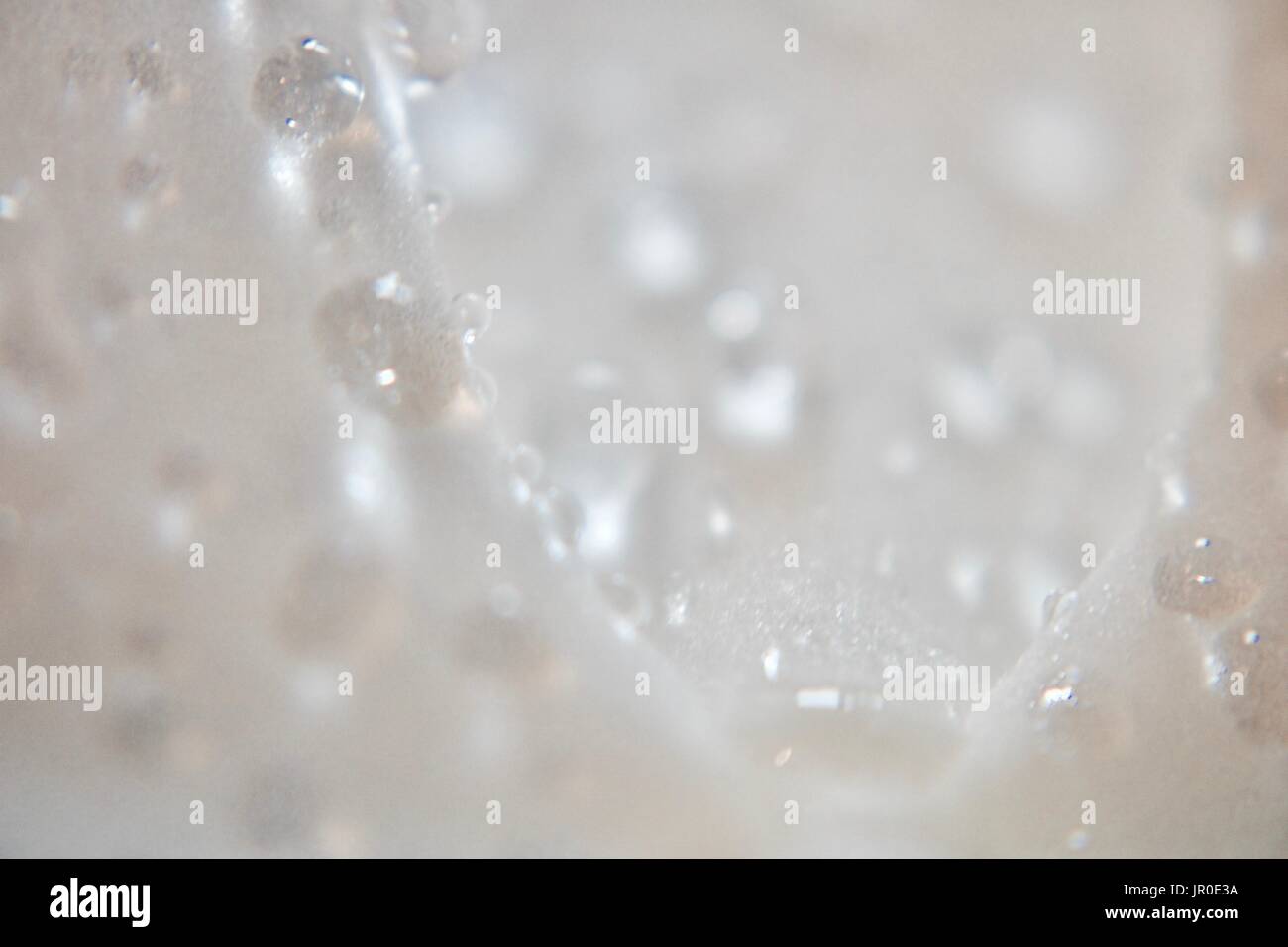Small water drops with sun reflex. Nice white background Stock Photo ...