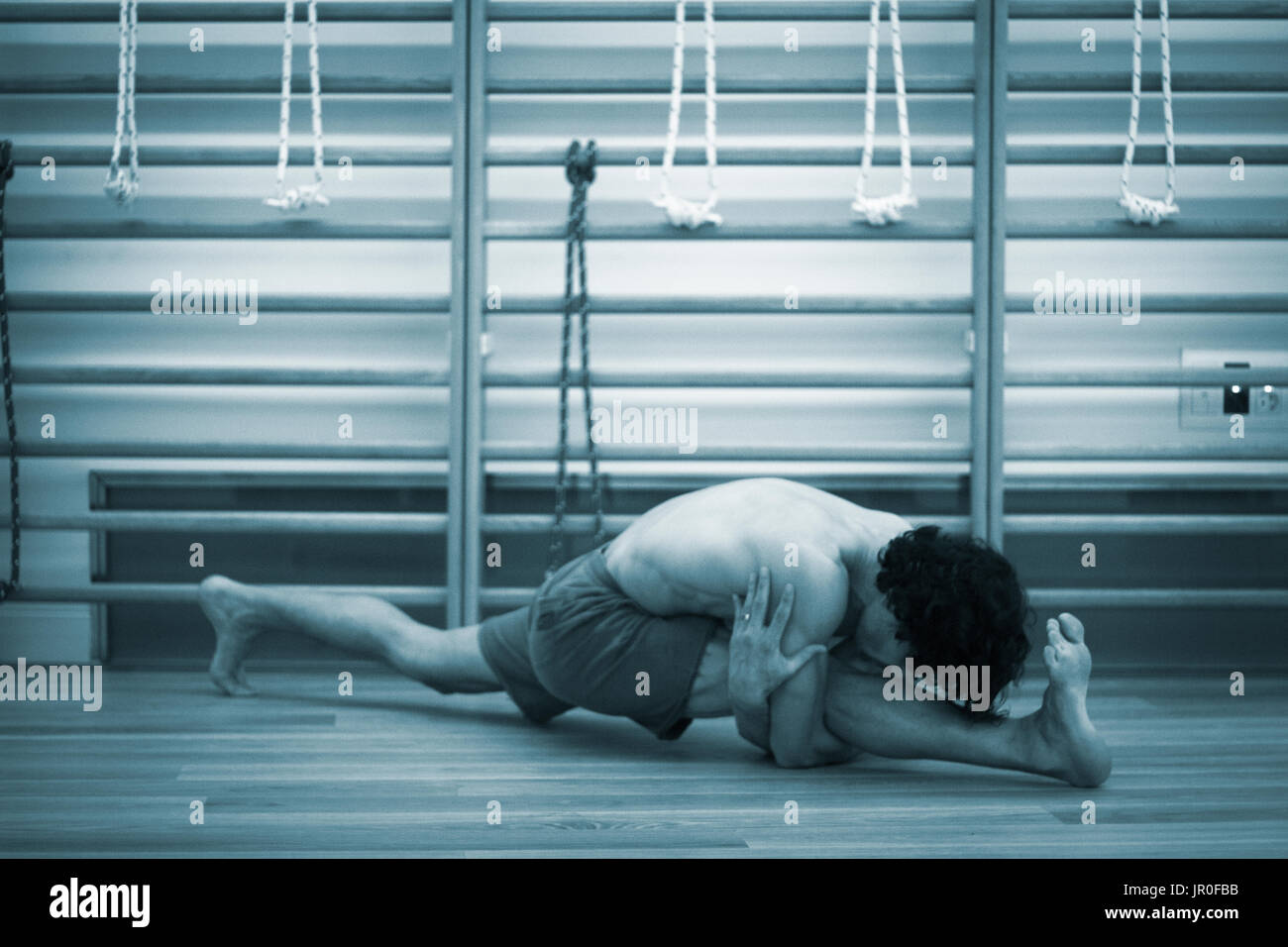 Male athlete doing splits hi-res stock photography and images - Alamy