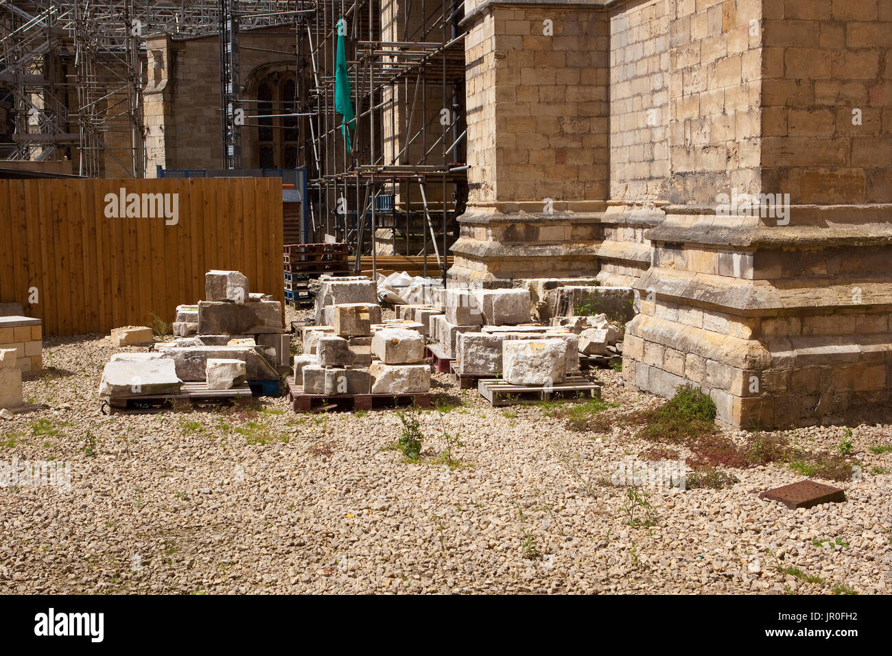 stone masons yard in york with scaffolding and york stone being carved ...