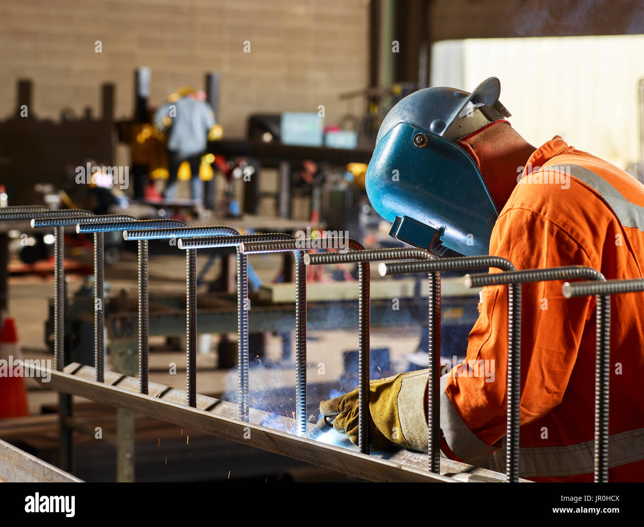 A Welder Wears A Visor And Welds In A Workshop; Edmonton, Alberta ...