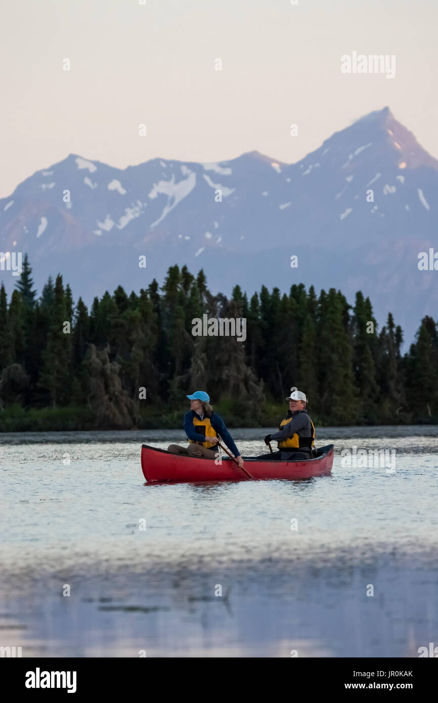 A Couple Canoeing On Stone Step Lake; Homer, Alaska, United States Of ...
