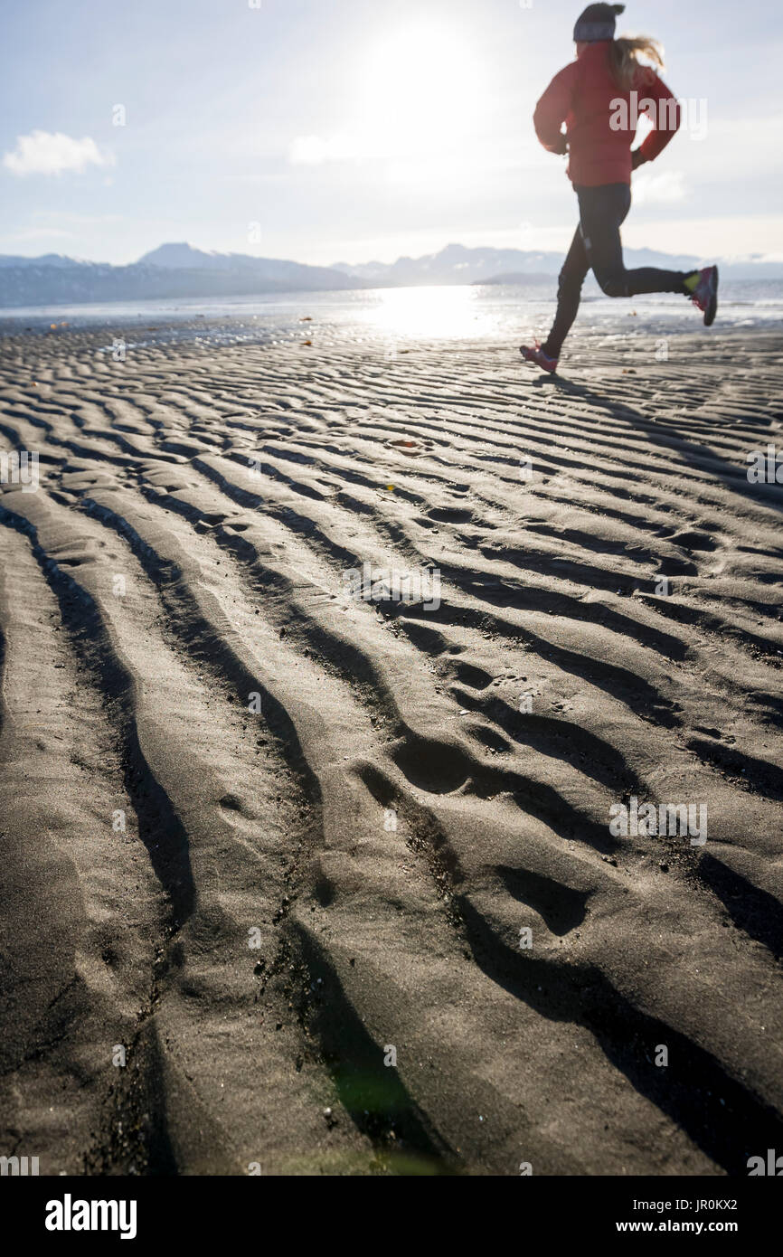 Woman jogs on beach hi-res stock photography and images - Alamy