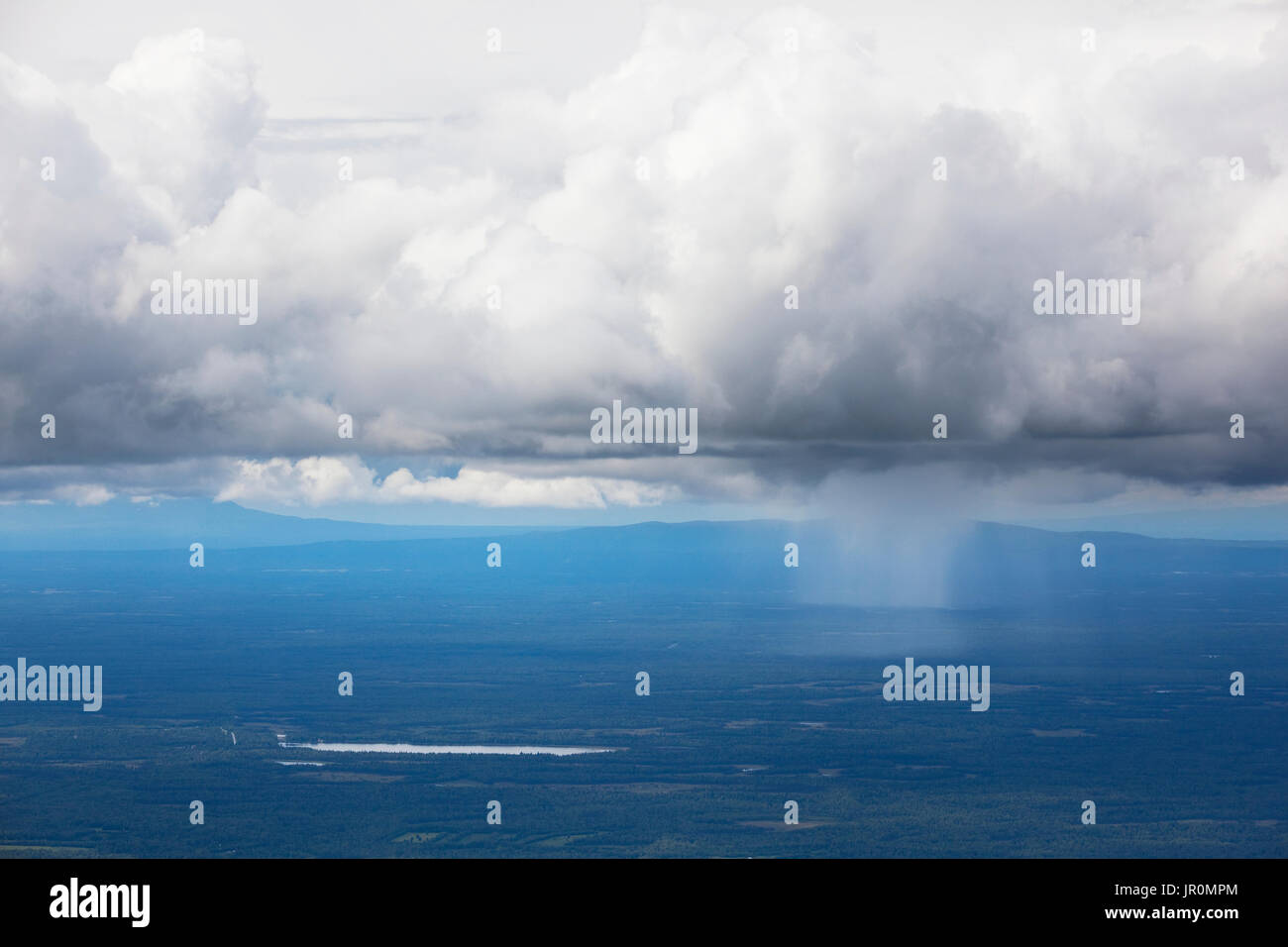 A Storm Cloud Over The Blue Ocean Water With Rain Falling, Matanuska ...