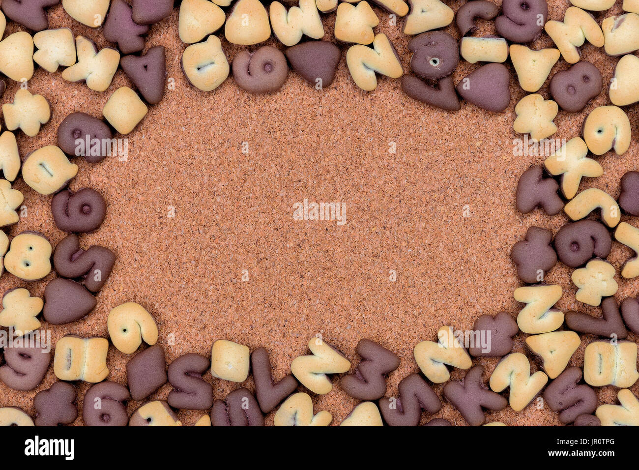 Biscuits background, Sweet cookie frame with cork background Stock ...