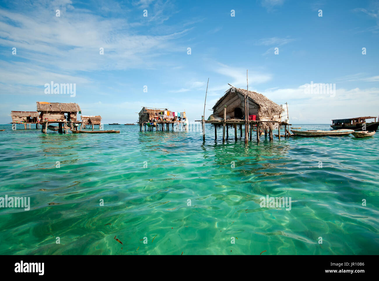 Bajau laut floating village of stilted houses off the coast of Borneo ...