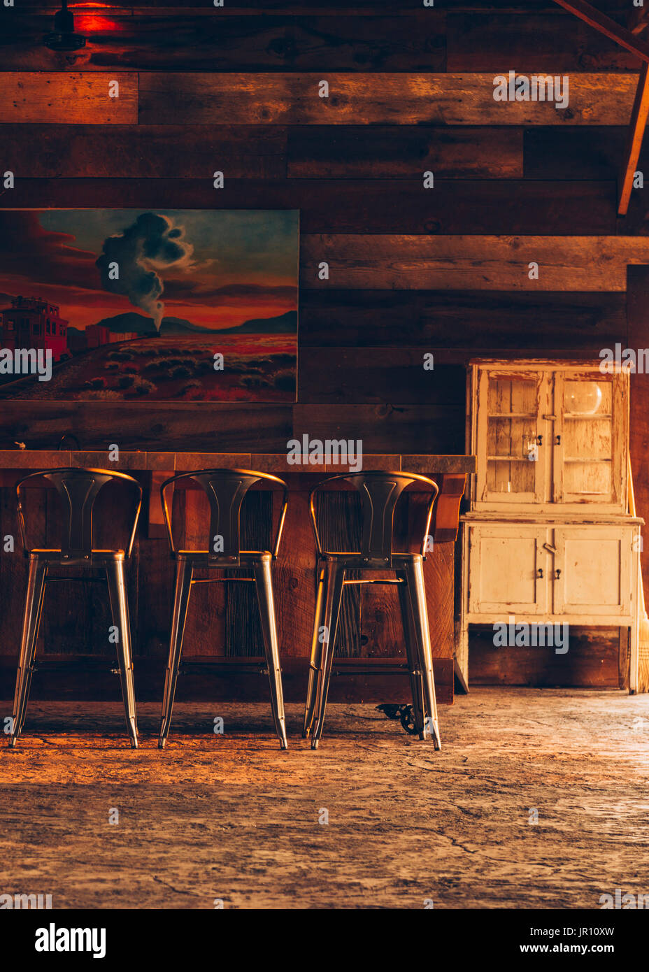 bar inside a barn, rustic bar, sun set Stock Photo - Alamy