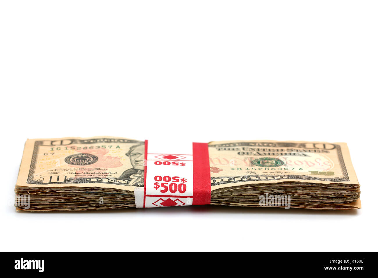 Stacks of ten dollar bills isolated on a white background Cut Out Stock ...