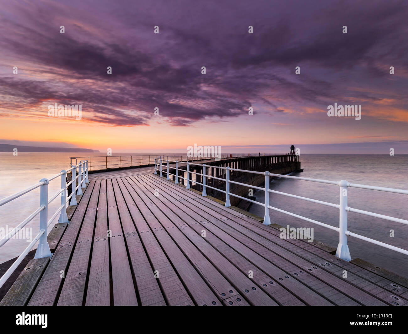 Sunset of Whitby's west pier Stock Photo - Alamy