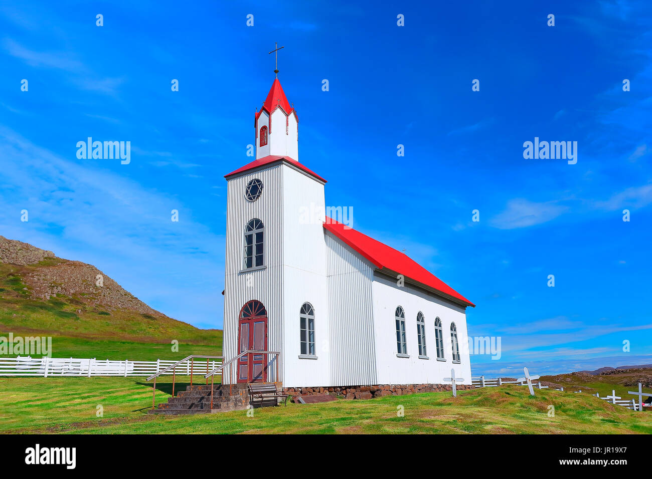 Church with red roof of Helgafell to the south of Stykkisholmur ...