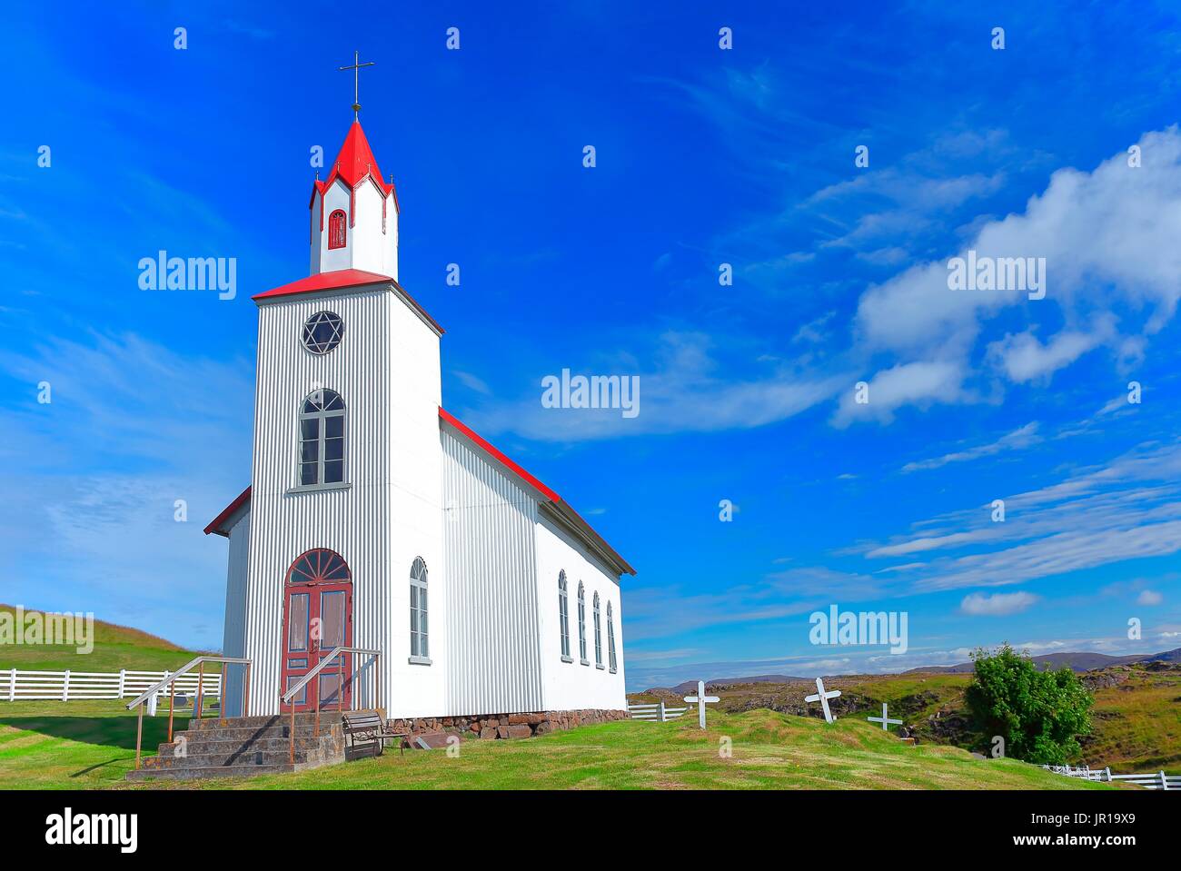 Church with red roof of Helgafell to the south of Stykkisholmur ...